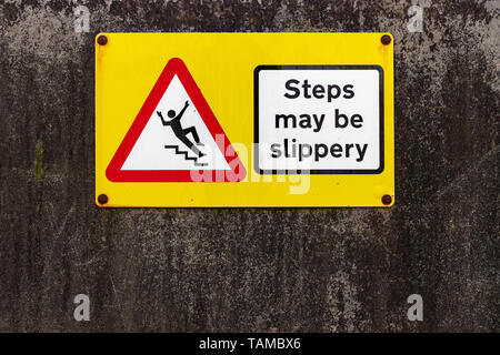 'Caution Steps Slippery When Wet' Signage Stock Photo - Alamy