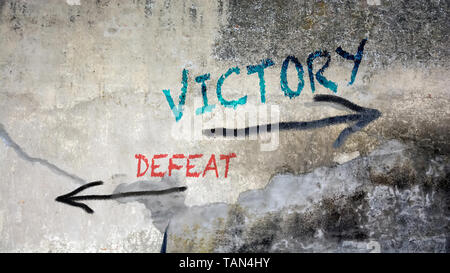 Wall Graffiti Victory versus Defeat Stock Photo - Alamy