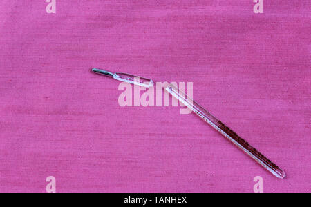 mercury glass thermometer broken Stock Photo - Alamy