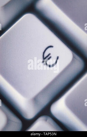 Computer keyboard with euro symbol key in green Stock Photo - Alamy