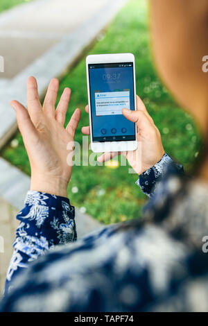 Female hand holding smartphone with UPDATE inscription, modern ...