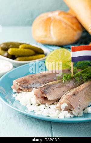 Traditional dutch food: herring fish with onion in fastfood market of ...
