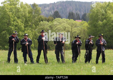Tanne, Germany. 26th May, 2019. Cow herders stand with their staffs at ...