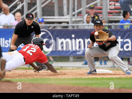 May 26, 2019: Texas Airhogs pitcher Gan Quan (30) keeps an eye on a ...
