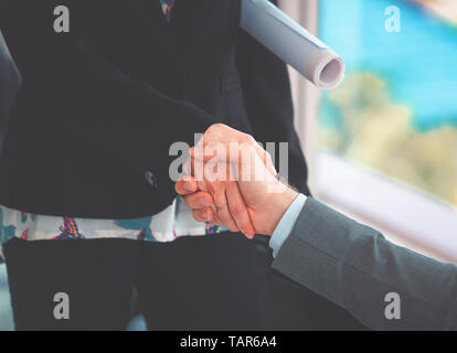 Business woman handshaking each other over a deal Stock Photo - Alamy