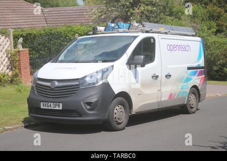 A BT OPENREACH VAUXHALL VIVARO VAN PARKED AT THE ROADSIDE WITH A ...