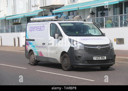 A BT OPENREACH VAUXHALL VIVARO VAN PARKED AT THE ROADSIDE WITH A ...