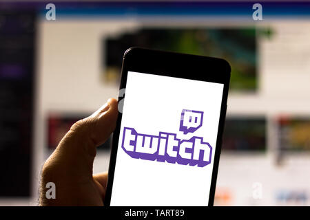 In this photo illustration, a Twitch logo seen displayed on a ...