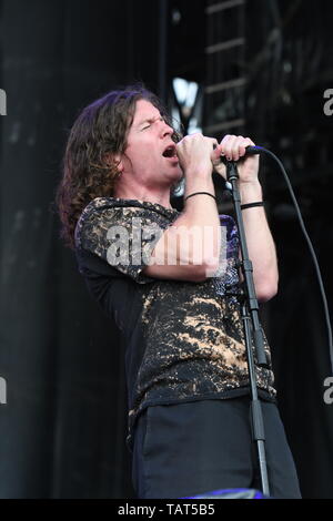 Singer Brendan Yates is shown performing on stage during a "live" stand ...