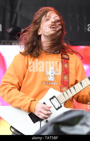 Lead guitarist Brady Ebert is shown performing on stage during a "live ...