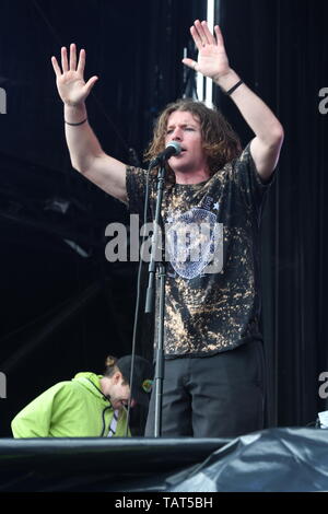 Singer Brendan Yates is shown performing on stage during a "live" stand ...