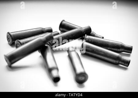 Empty bullet shells on a white background Stock Photo - Alamy