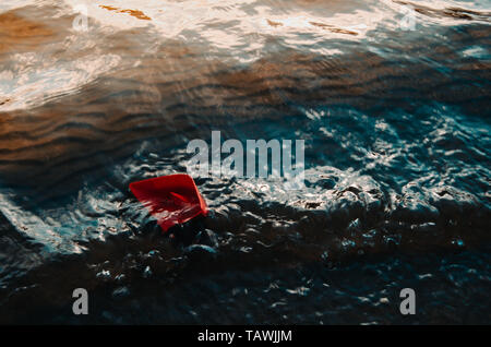 Small,red,paper boat is shipwrecked in a turbulent raging sea Stock ...