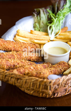 Chicken nuggets with rice and sauce Stock Photo - Alamy