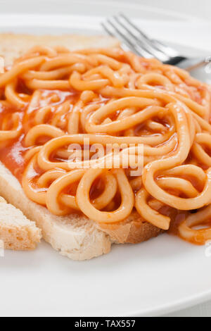 a plate of canned spaghetti on toast Stock Photo - Alamy