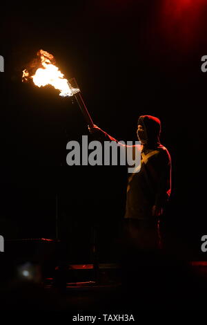 Drummer Josh Dun is shown performing on stage during a "live" stand up ...