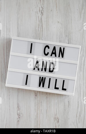 Modern board with 'I can and I will' words, clipboard with blank sheet ...