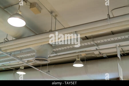 Air duct, wiring and plumbing in the mall. Air conditioner pipe, wiring ...