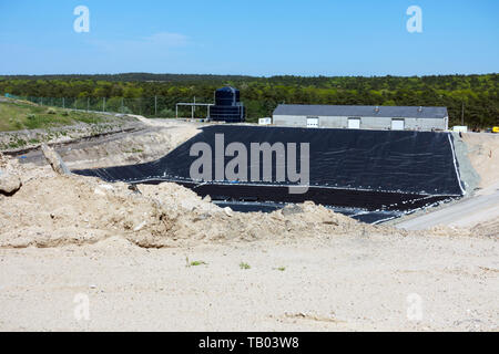 New waste disposal cell being built at landfill with big hole excavated ...