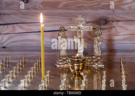 The altar with a candle for the repose in the Orthodox Church. candle ...
