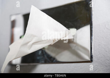 Close up of a tissue dispenser mounted to a wall Stock Photo - Alamy