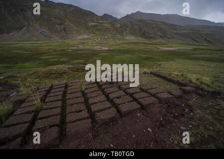 Sun-dried adobe mud bricks are seen in this exposed wall of an historic ...