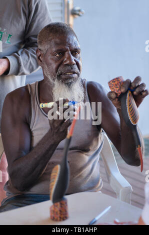 Tiwi Islander artist proudly signing one of his Tiwi bird wooden ...