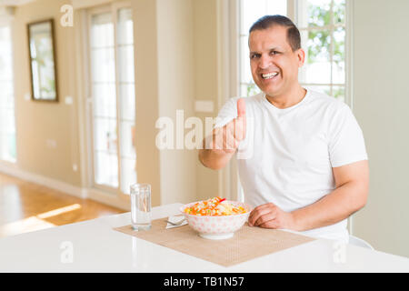 Indian man eating rice with right hand Stock Photo - Alamy