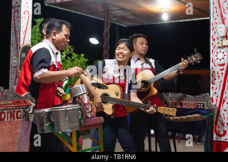 Traditional Batak family band performs in Tuk Tuk, Samosir Island, Lake ...