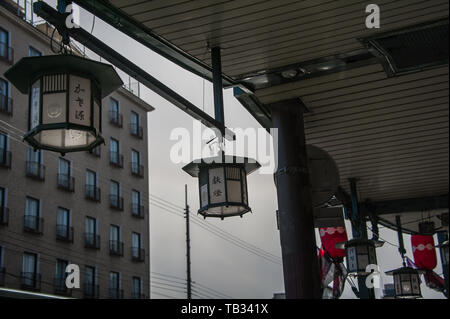 Japan in evening with illuminated hanging lantern lamp light on wooden ...