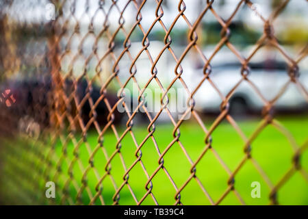 Rust steel net with blur football field Stock Photo - Alamy
