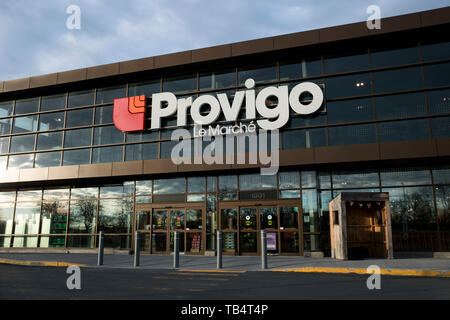 A logo sign outside of a Provigo retail grocery store location in ...