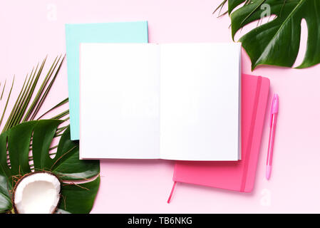 Female blog writer workspace concept. Green monstera palm leaves ...