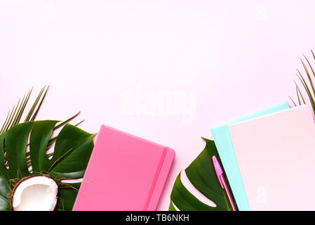 Female blog writer workspace concept. Green monstera palm leaves ...