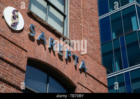 A logo sign outside of the headquarters of Sarepta Therapeutics in ...