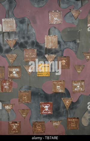 A collection of landmine warning signs from all over the world ...