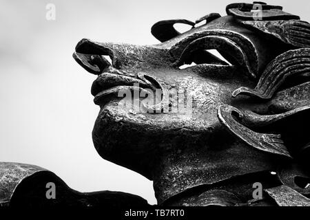 Face of an old rusty statue in public park Stock Photo - Alamy