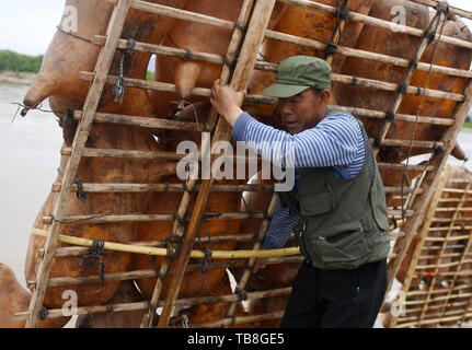 Sheepskin raft by the Yellow River in Lanzhou Gansu China Stock Photo ...