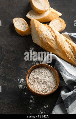 Fresh French baguette on grunge background Stock Photo - Alamy