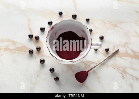 Spoon with acai powder on light background Stock Photo - Alamy