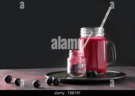 Mason jar of acai smoothie with powder on white background Stock Photo ...