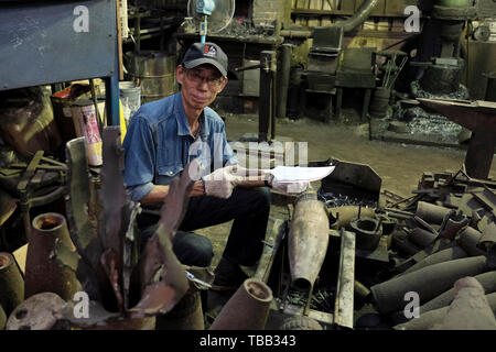Taiwanese blacksmith Wu Tseng-tong known as Maestro Wu crafts a knife ...