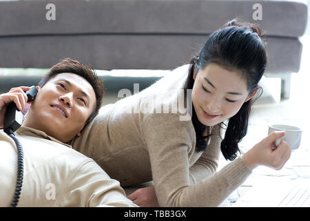 A couple snuggled up together Stock Photo - Alamy