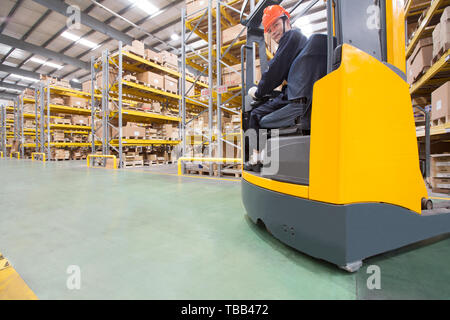 Logistics personnel load and unload cargo at the warehouse Stock Photo ...