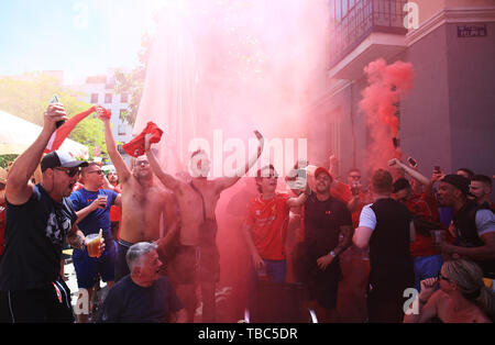 Liverpool fans set off smoke flares near Liverpool Waterfront as they ...