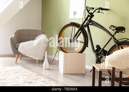 Modern bicycle in interior of living room Stock Photo - Alamy