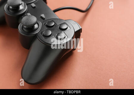 Modern game pad on color background Stock Photo - Alamy