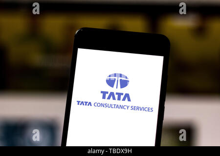 In this photo illustration, a Tata Consultancy Services (TCS) logo is ...