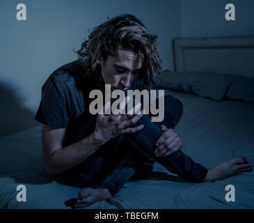 Devastated depressed millennial man crying sad feeling hurt suffering ...