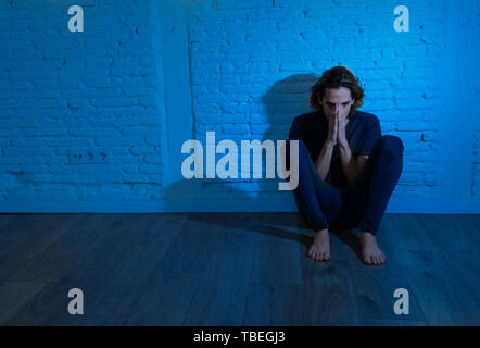 Devastated depressed millennial man crying sad feeling hurt suffering ...